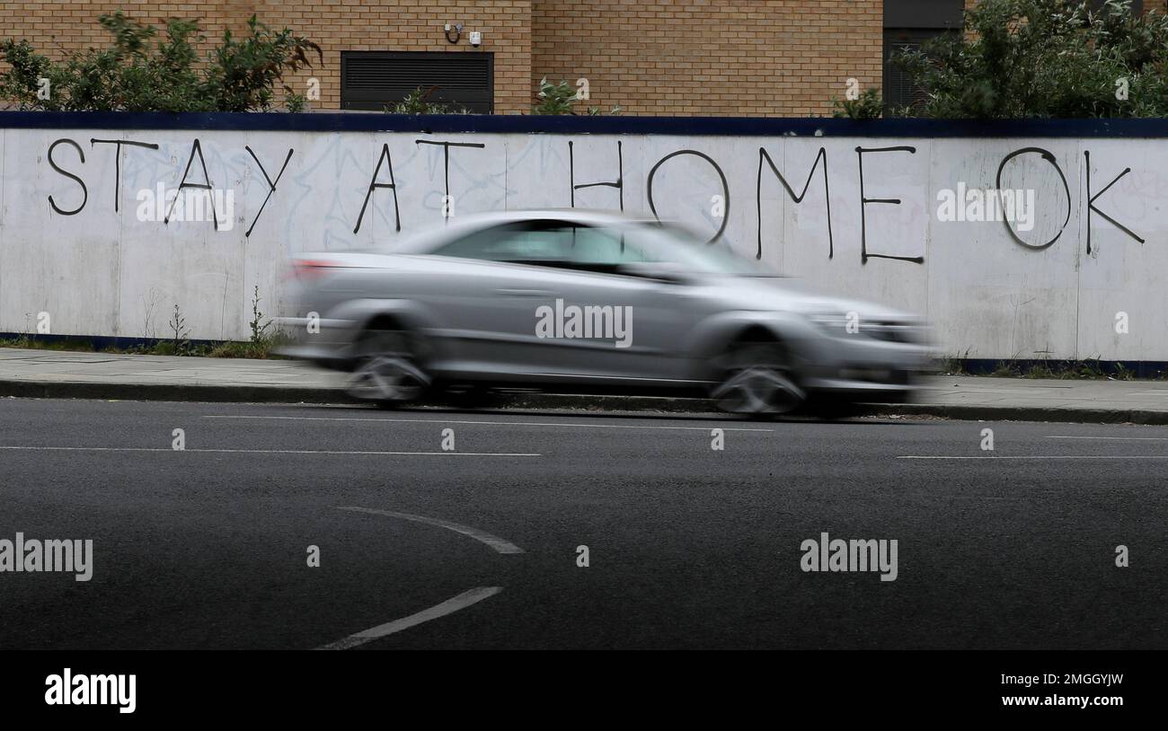 FILE - In this Monday, April 13, 2020 file photo a car passes graffiti ...