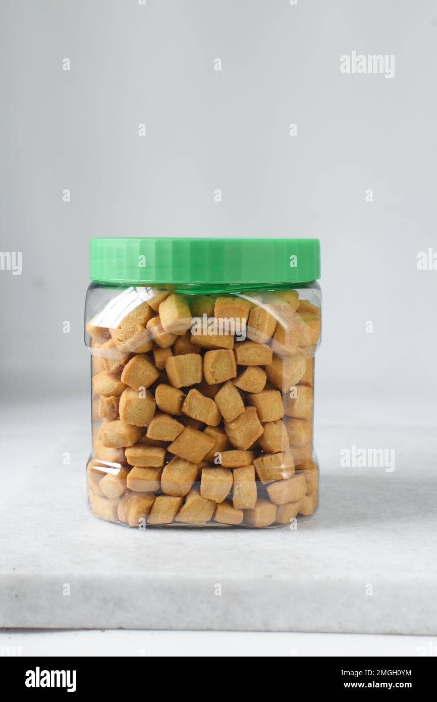 Nigerian Chin chin in a plastic jar, Fried chin-chin snack in a plastic ...