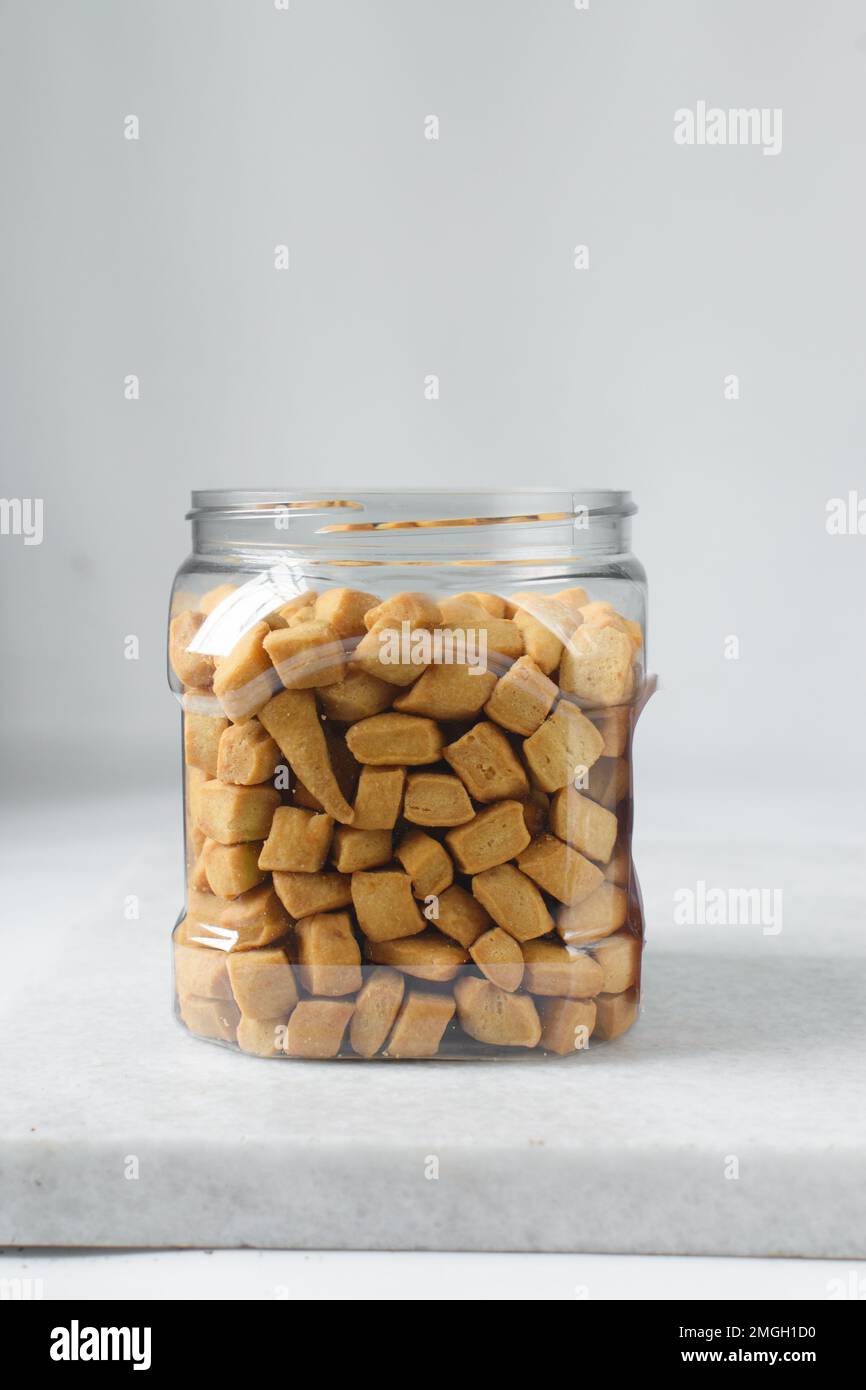 Nigerian Chin chin in a plastic jar, Fried chin-chin snack in a plastic ...