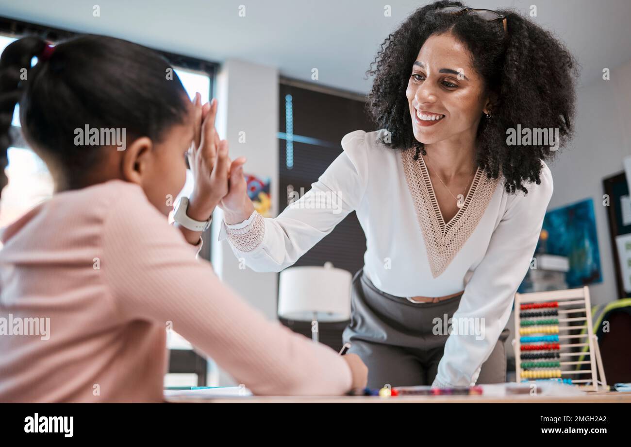 High five, success or teacher in celebration with a student in a ...