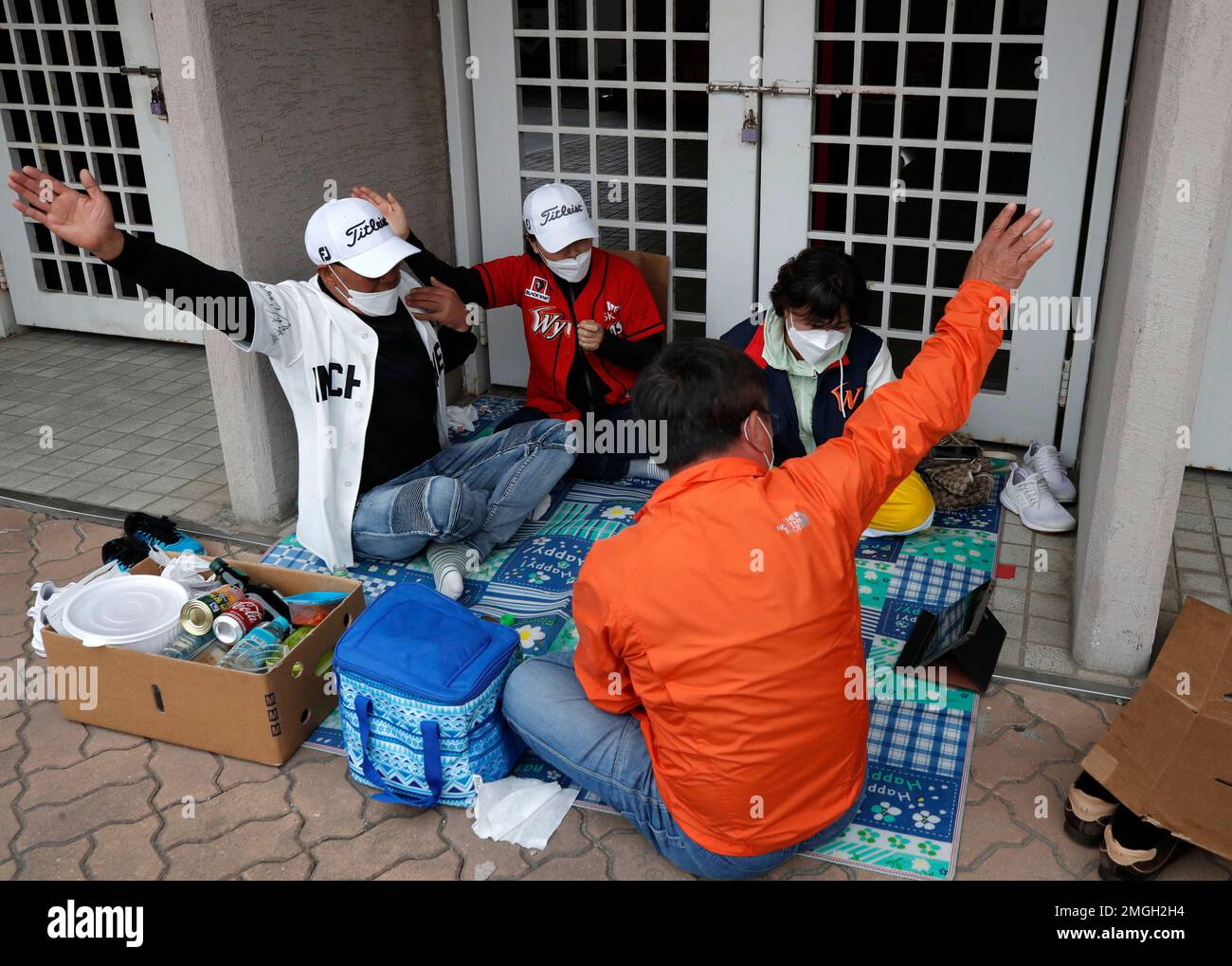 SK Wyverns baseball team fans wearing face masks watch the live ...
