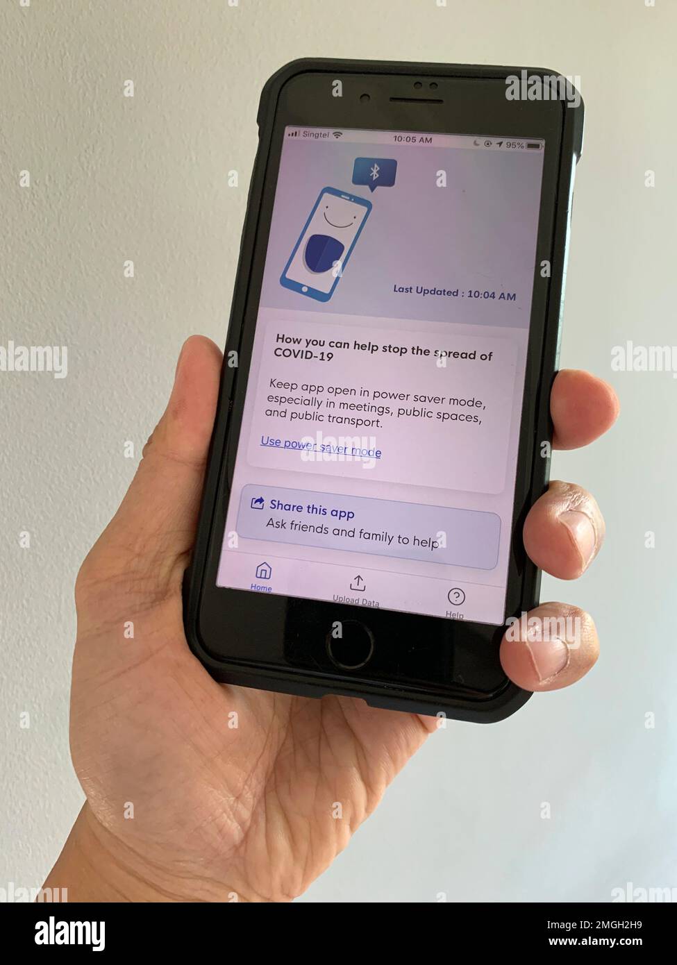 The TraceTogether contact tracing app appears on a mobile phone in ...