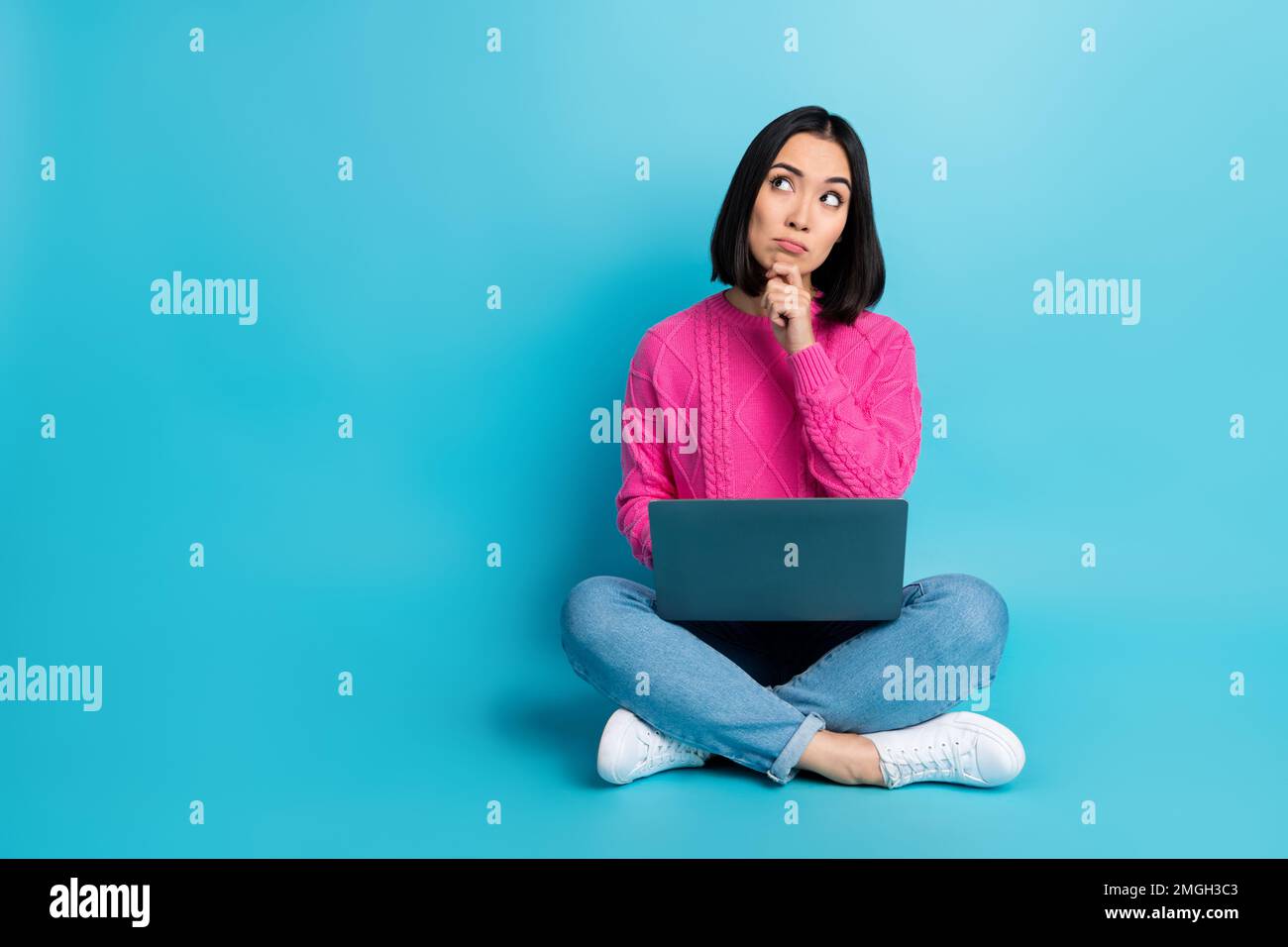 Full length photo of pretty doubtful lady wear pink pullover reading ...