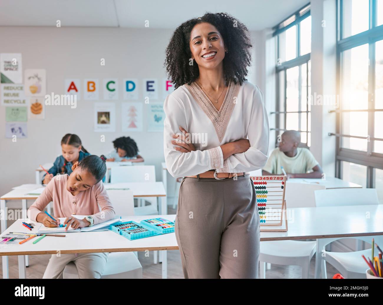 School teacher, woman portrait and classroom for education, learning ...