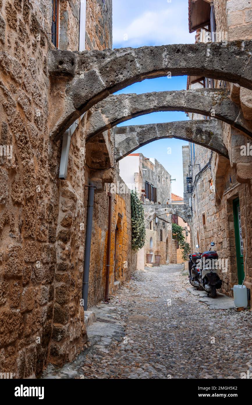 Street view of old town of Rhodes, Greece. Paved roads and pavements ...