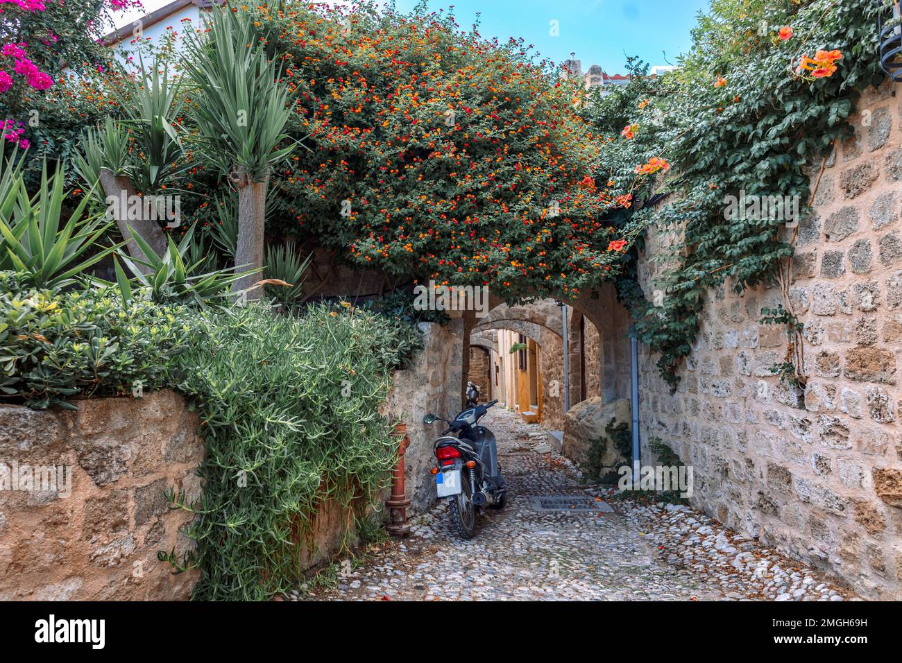 Street view of old town of Rhodes, Greece. Paved roads and pavements ...
