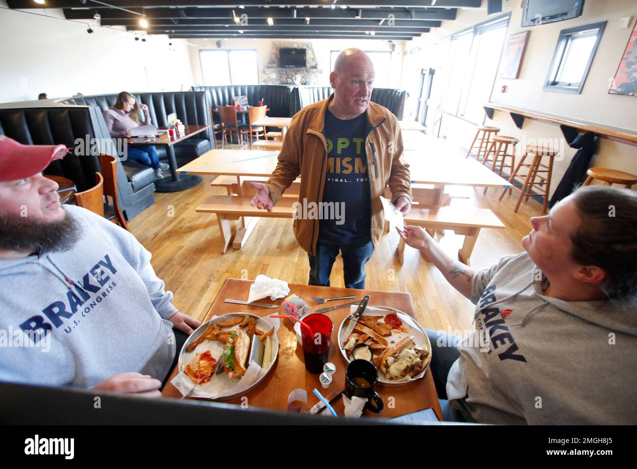 Rick Savage, center, owner of Sunday River Brewing Company, talks with ...
