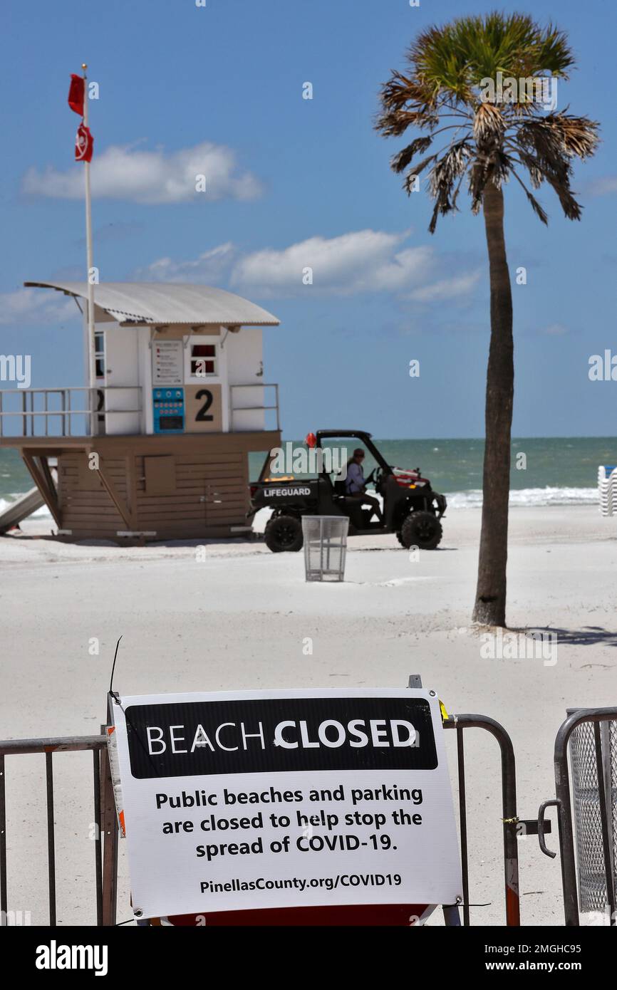 Lifeguards on Clearwater Beach change shifts on the closed beach ...