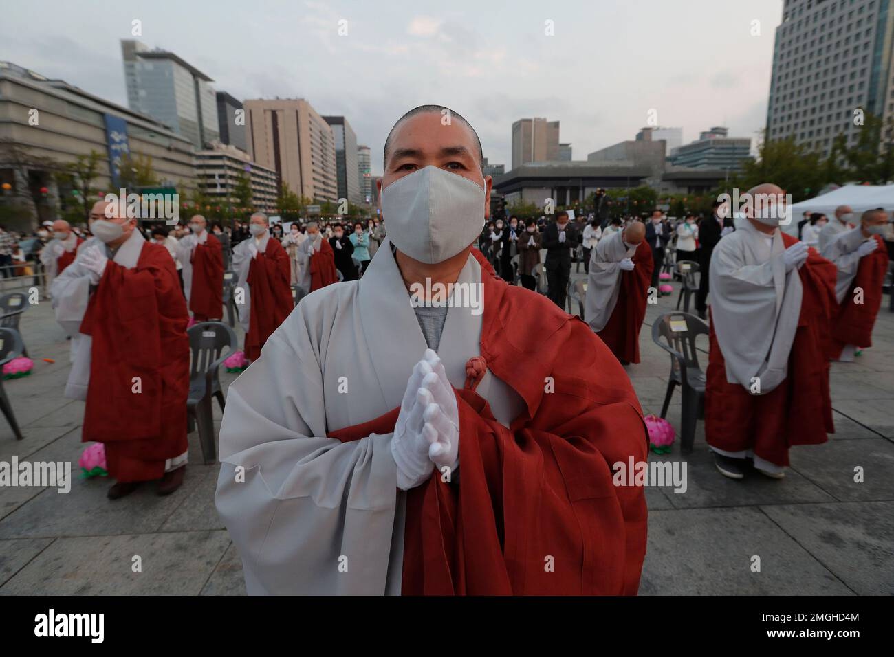Buddhists monks wearing faces masks to help protect against the spread ...
