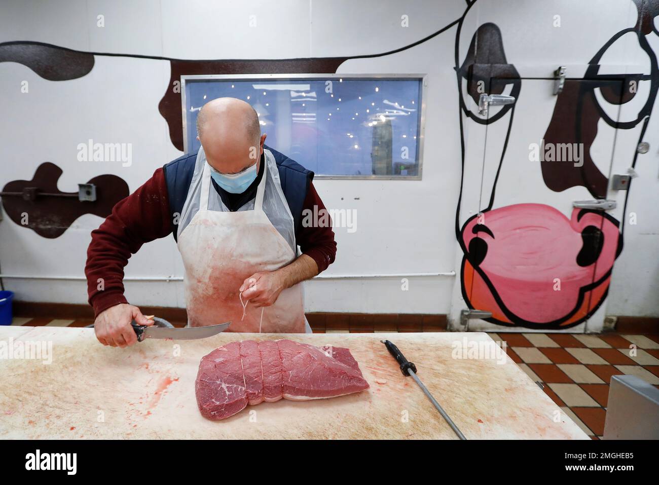 John Warminski prepares meat at Ronnie's Quality Meats in Detroit ...