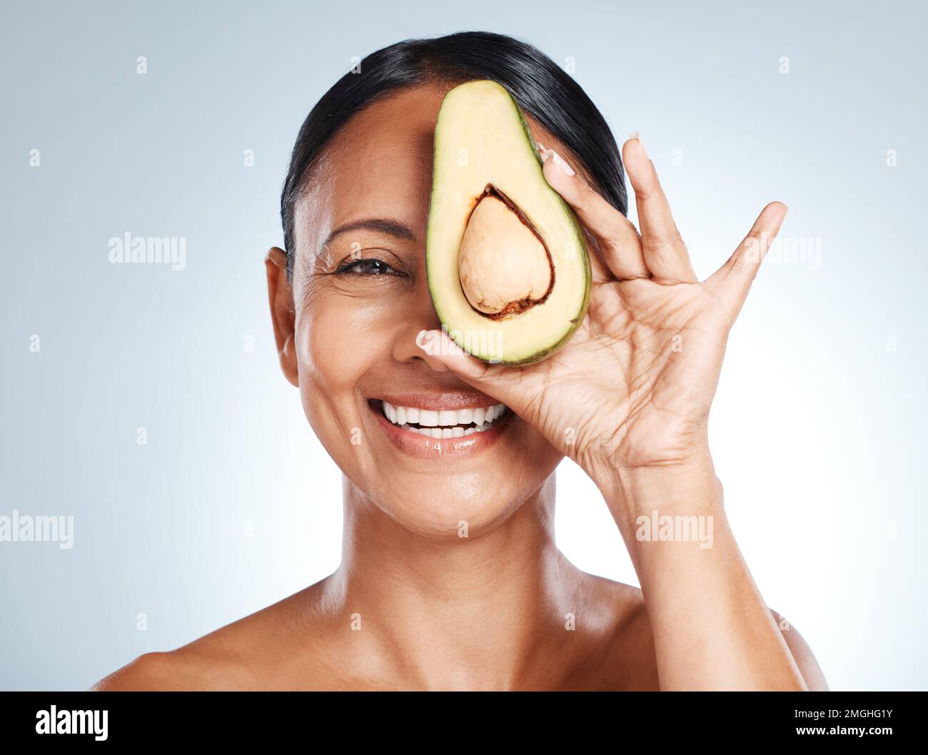 Beauty, avocado and portrait of woman in studio happy, detox and ...