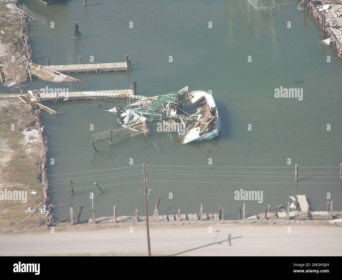 Aftermath - Jefferson Parish - 26-HK-38-47. overturned, destroyed boat ...
