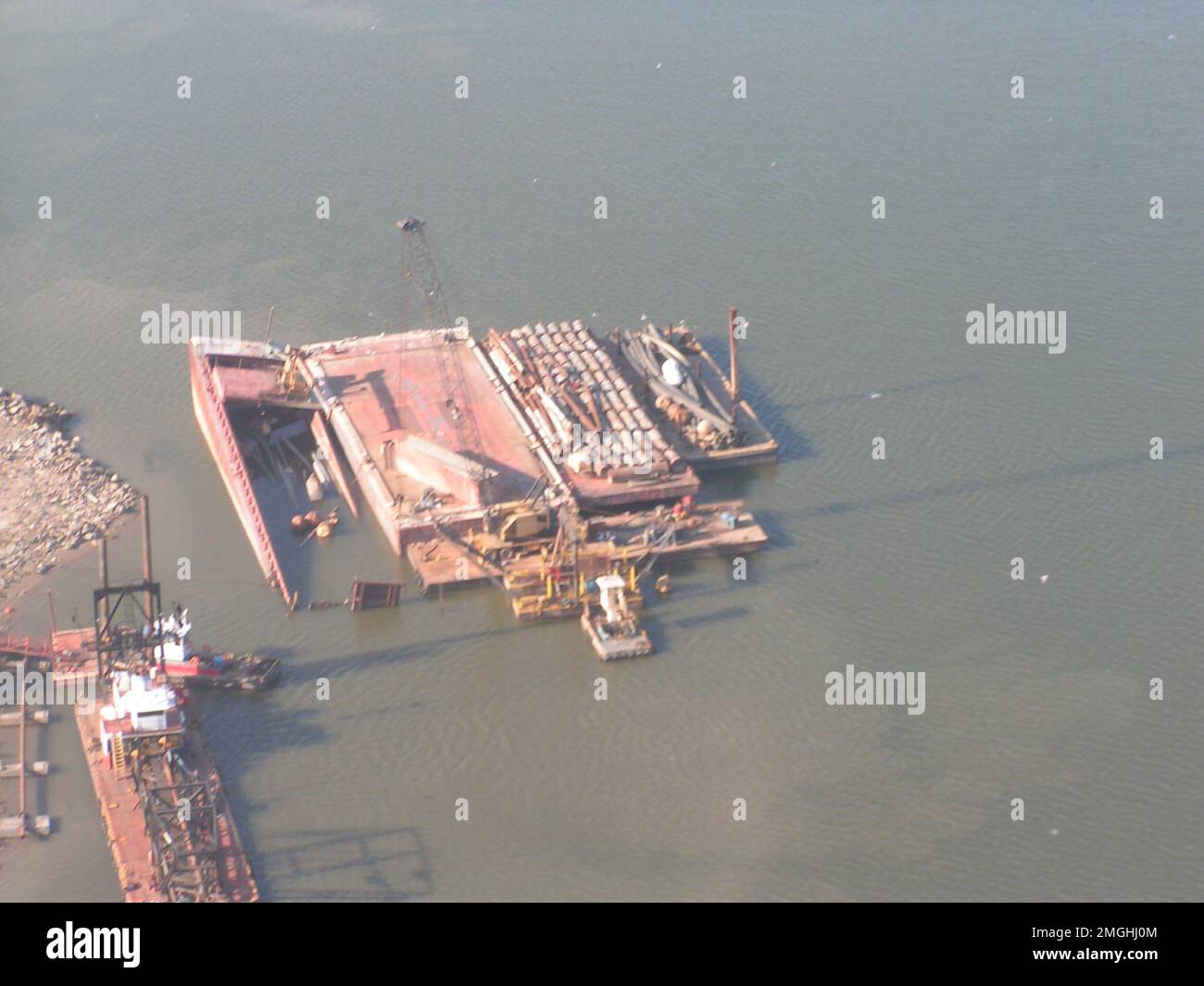 Aftermath - Jefferson Parish - 26-HK-38-48. partially submerged barge ...