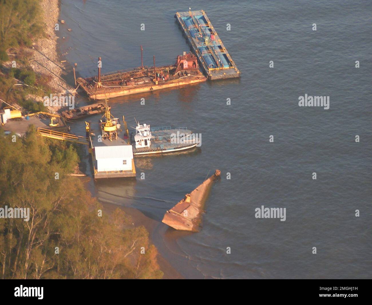 Aftermath - Jefferson Parish - 26-HK-38-42. mostly submerged barge and ...