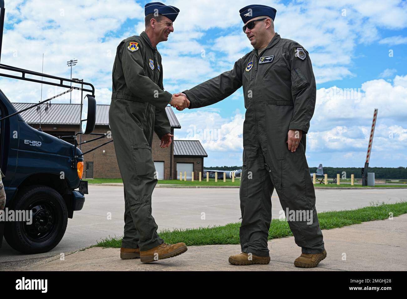 Maj. Gen. Corey Martin, 18th Air Force commander, is greeted by Col ...