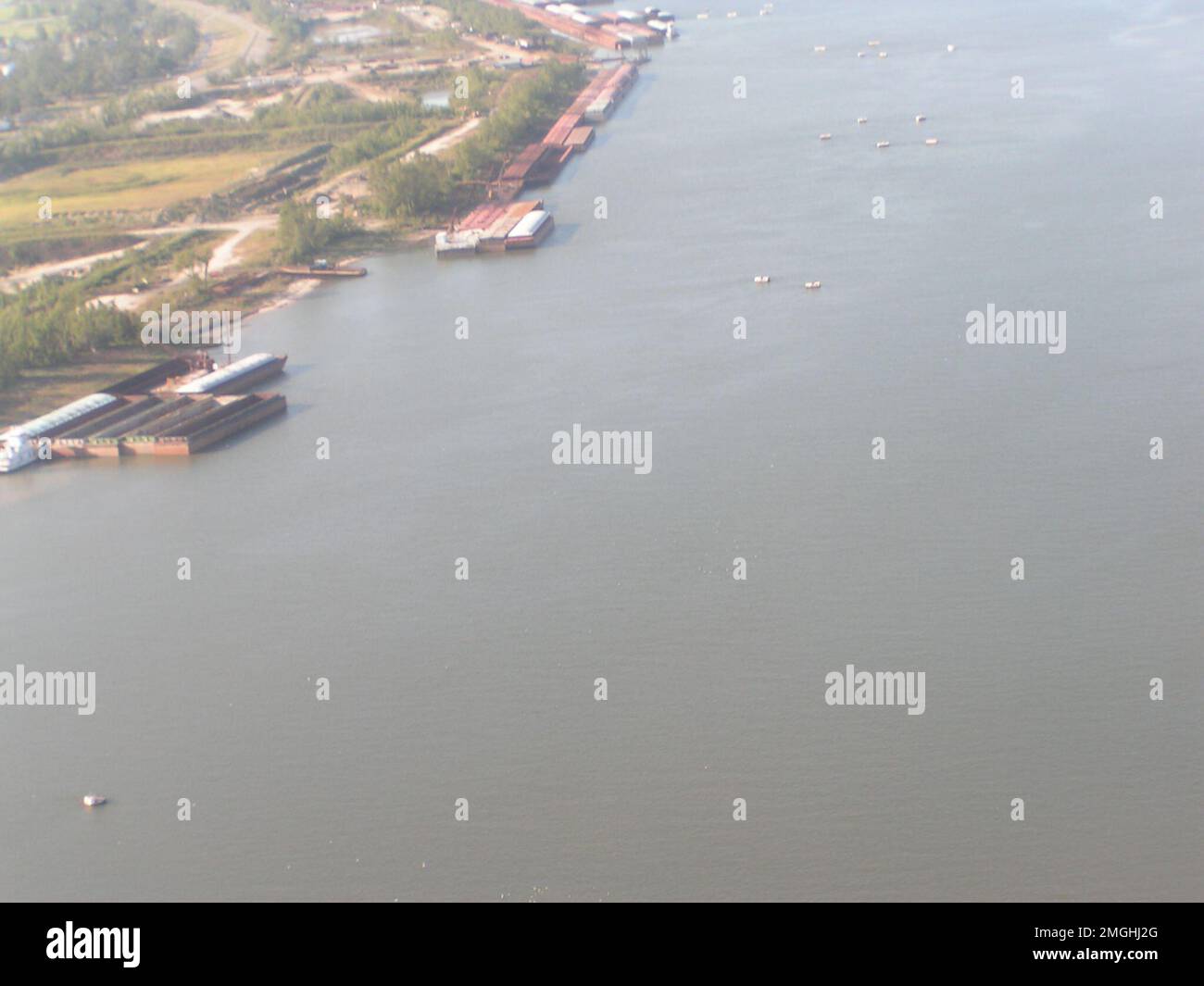 Aftermath - Jefferson Parish - 26-HK-38-45. numerous barges along ...