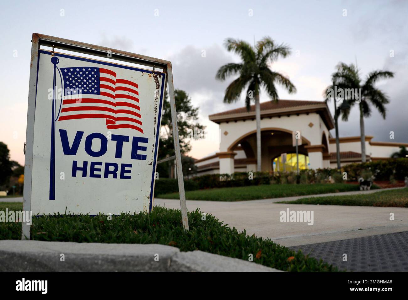 FILE - In this March 17, 2020, file photo a sign is seen outside a polling place at the Boca ...