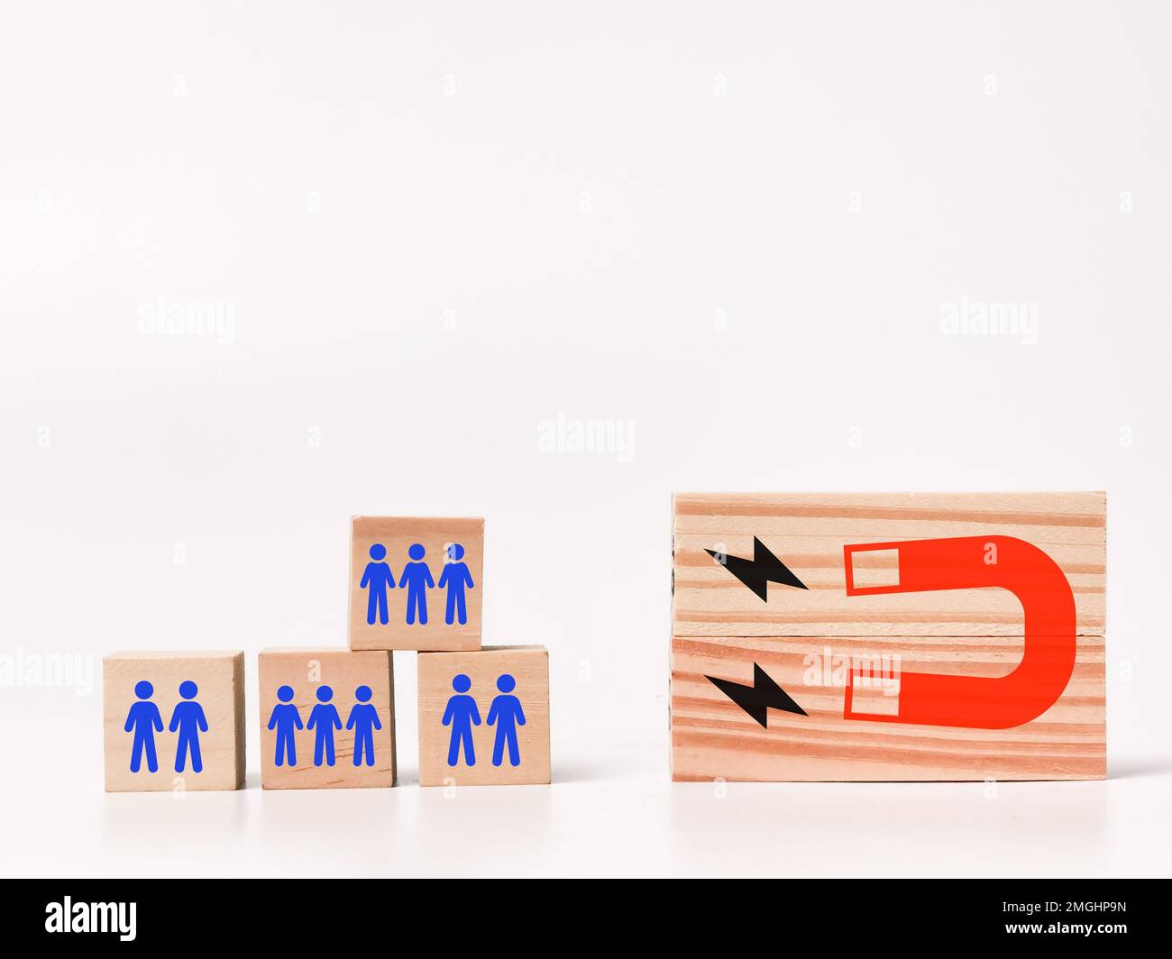 Wooden blocks with magnet and peoples icons. Customer retention concept ...