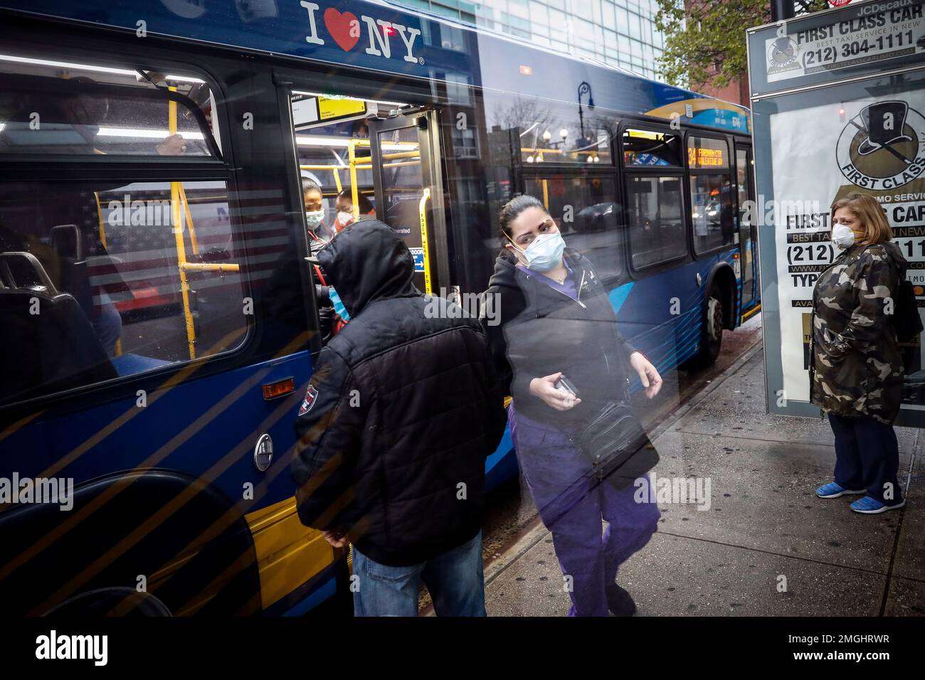 Customers wear personal protective equipment while boarding and ...