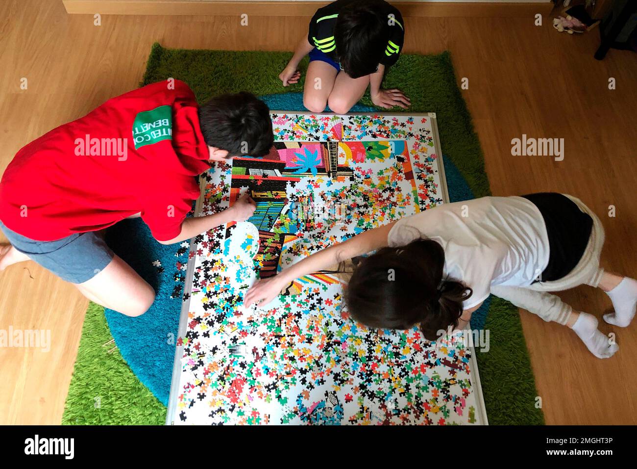 In this April 22, 2020, photo, triplets, from left, Diego, Caio and ...