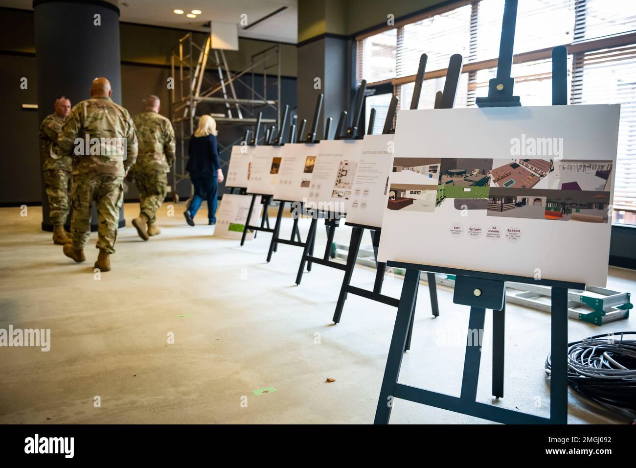 Billboards showing the base campus plan are displayed as U.S. Air Force ...