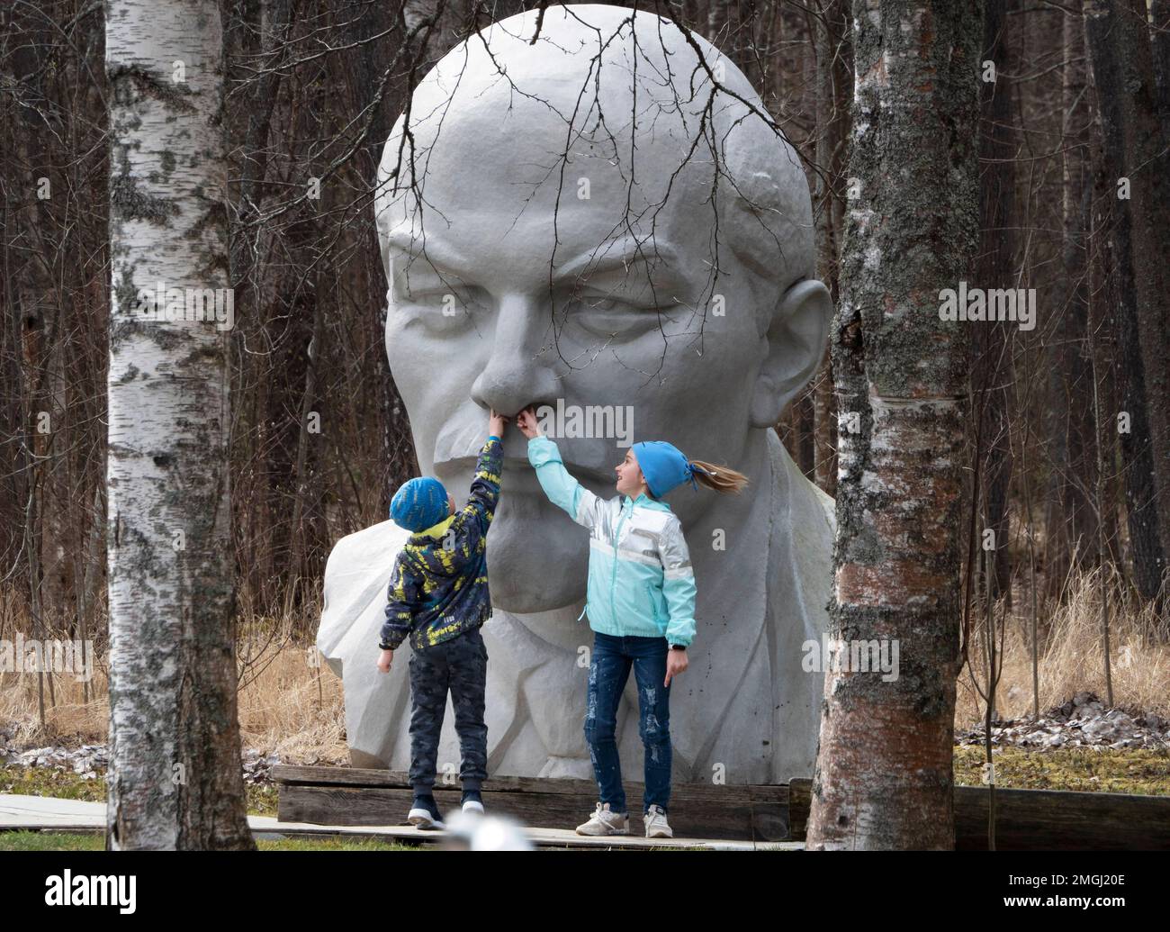 Children play near a statue of Soviet Union founder Vladimir Lenin in ...