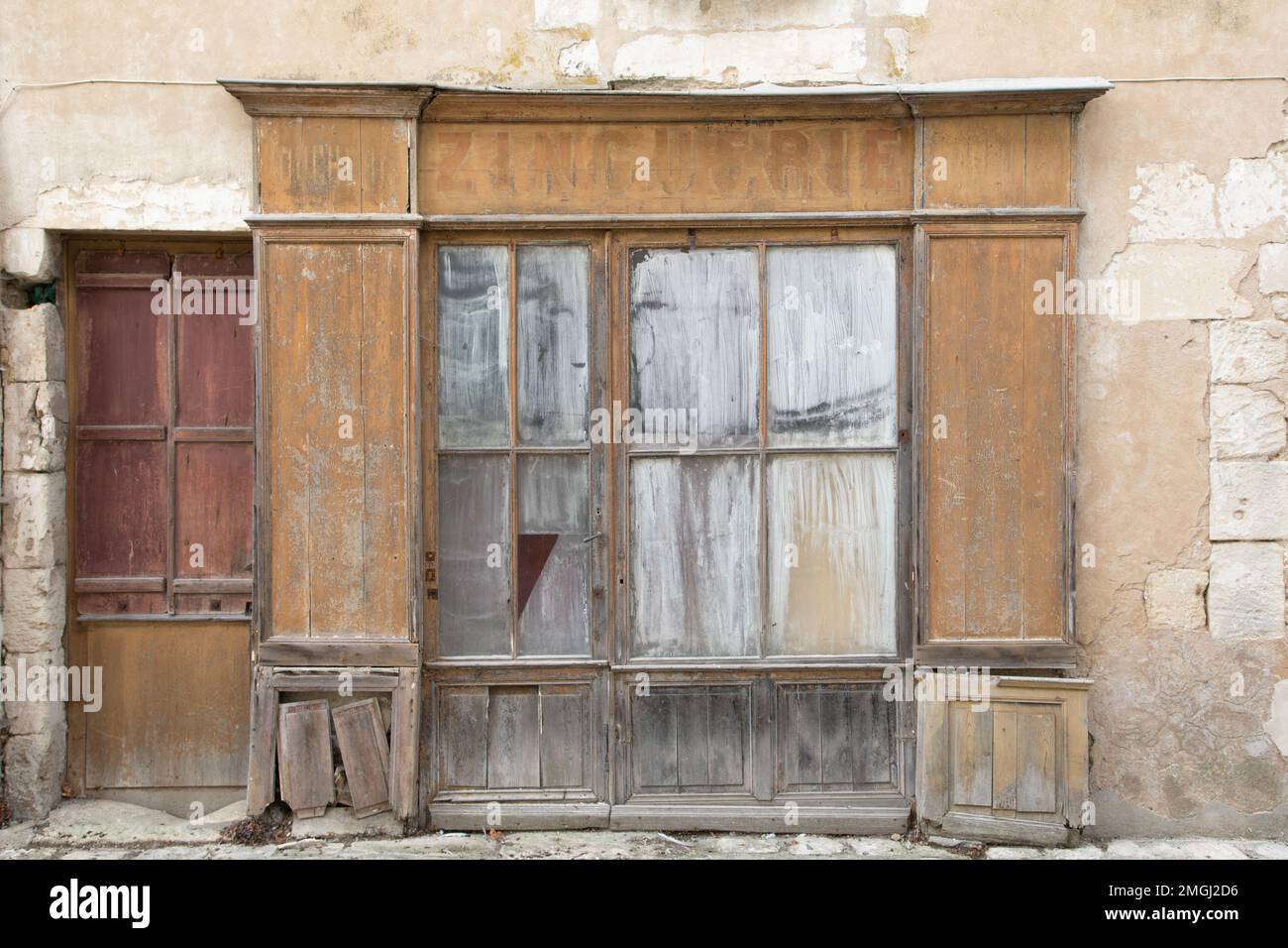 old retro abandoned wooden facade of an ancient worn wooden shop store ...