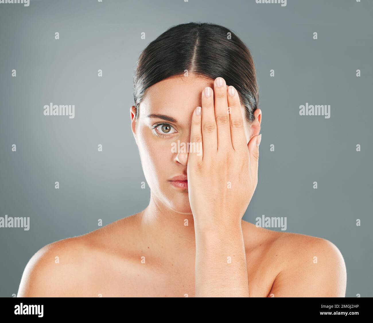 Face, cover and portrait of a woman with a hand on eye isolated on a ...