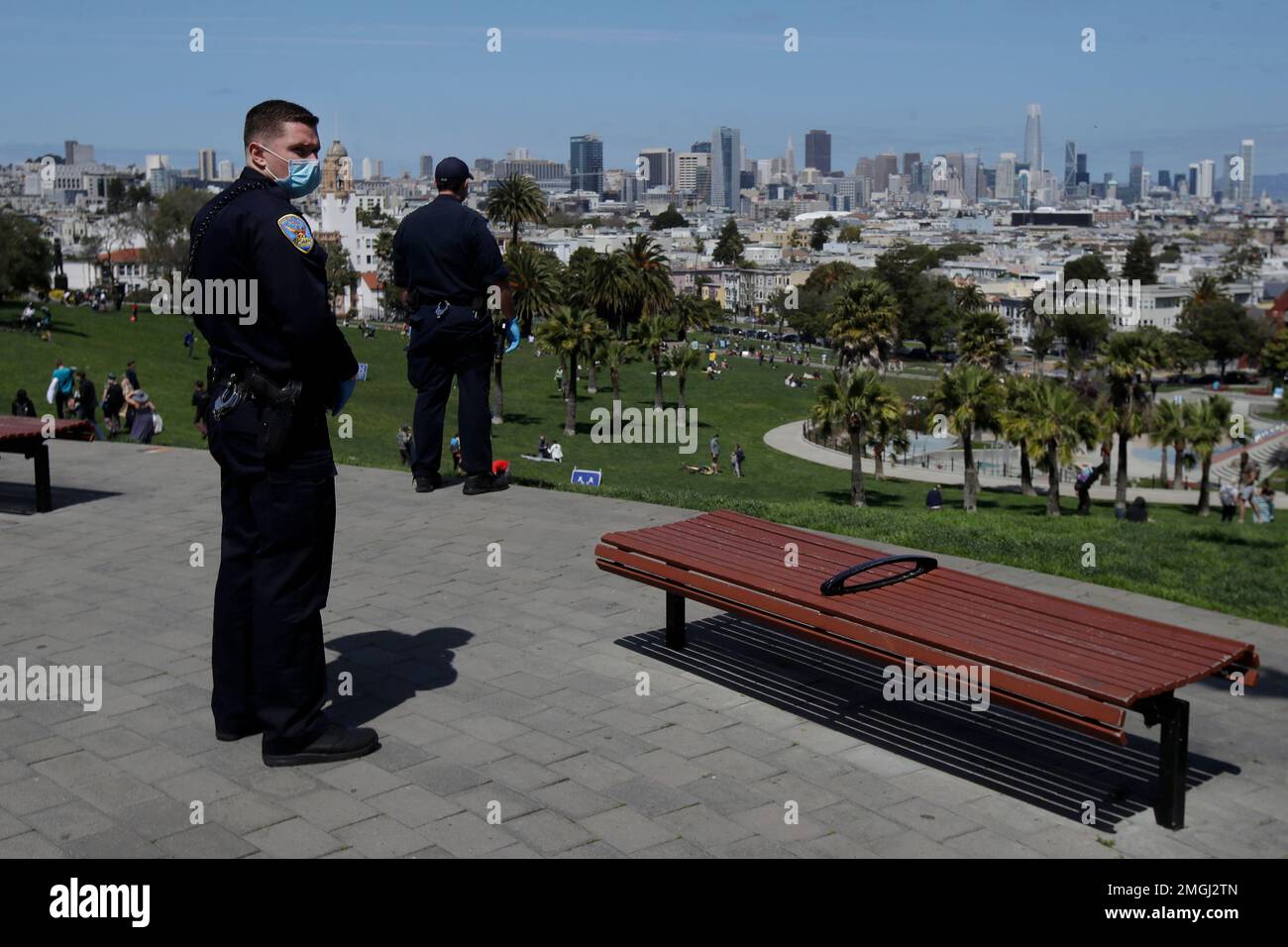 San Francisco Police officers watch as people begin to leave Dolores ...