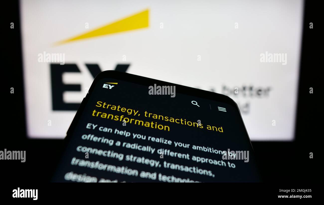 Smartphone with website of company Ernst Young Global Limited (EY) on ...