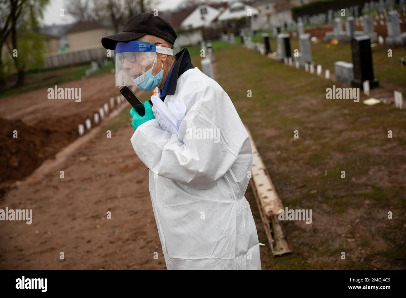 Rabbi Shmuel Plafker talks on the phone with Michael Tokar as he ...