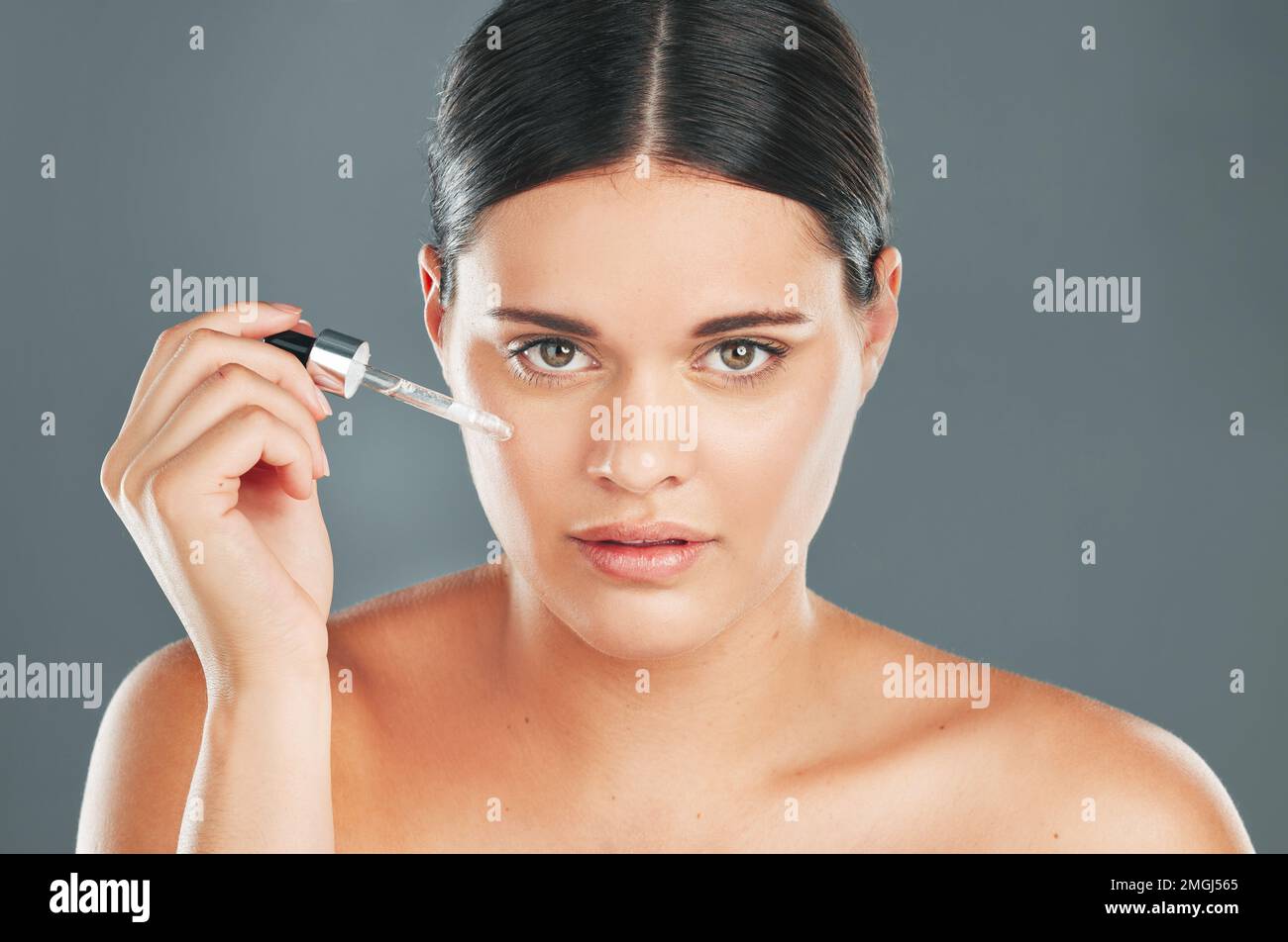 Portrait, woman and skincare with oil, dermatology and serum for ...