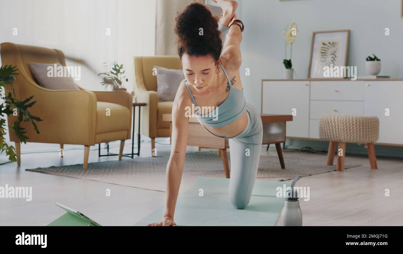 Yoga, tablet and woman with online video for stretching exercise in the ...