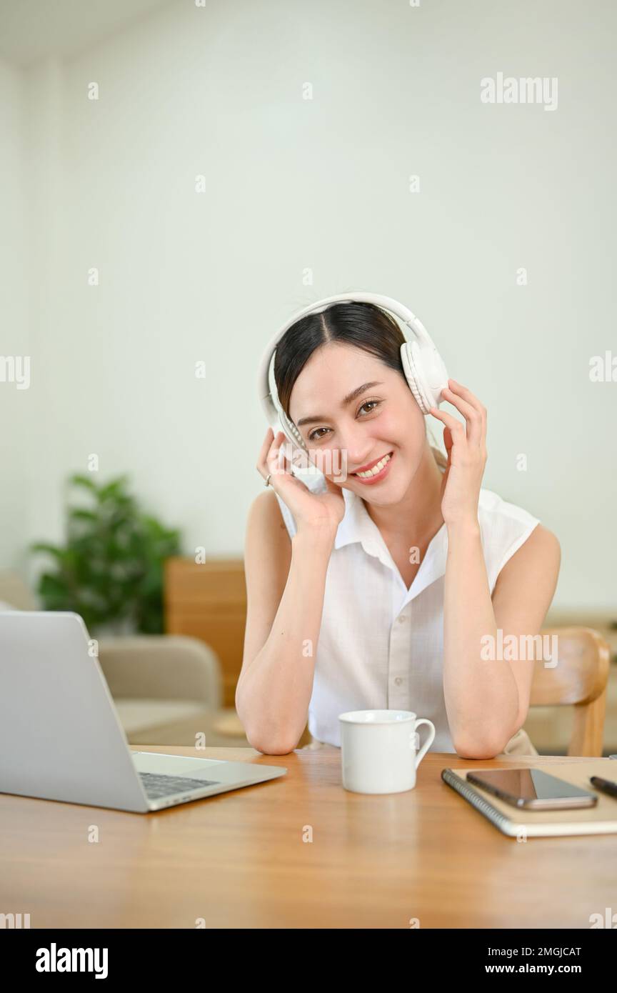 Portrait, Charming millennial Asian woman in casual clothes wearing ...