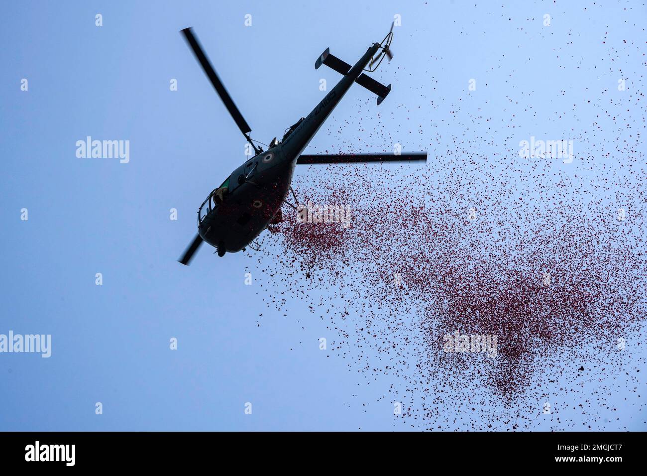 An Indian army helicopter showers rose petals over a Republic Day ...