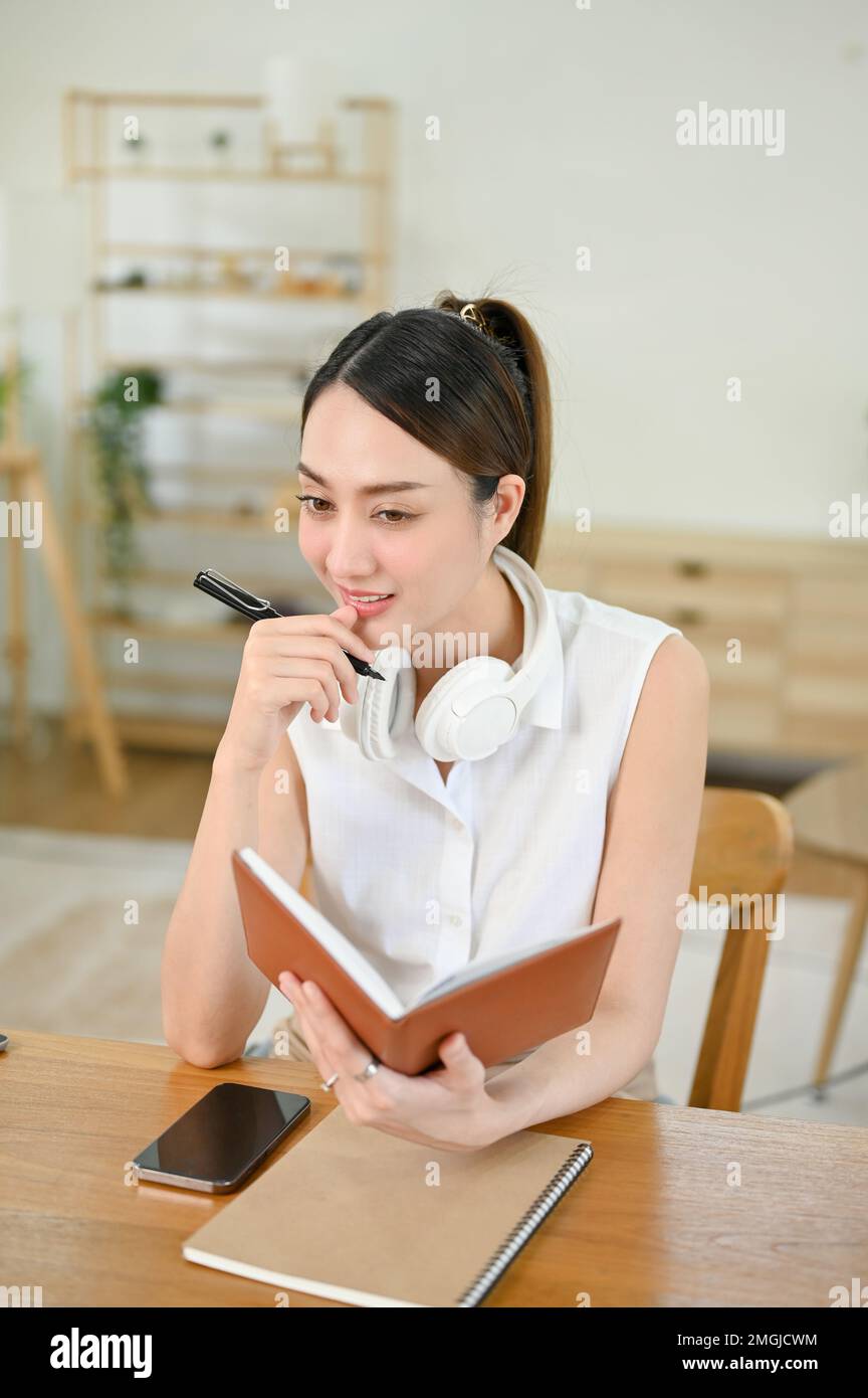 Portrait, Beautiful and smart young Asian female freelancer or college ...