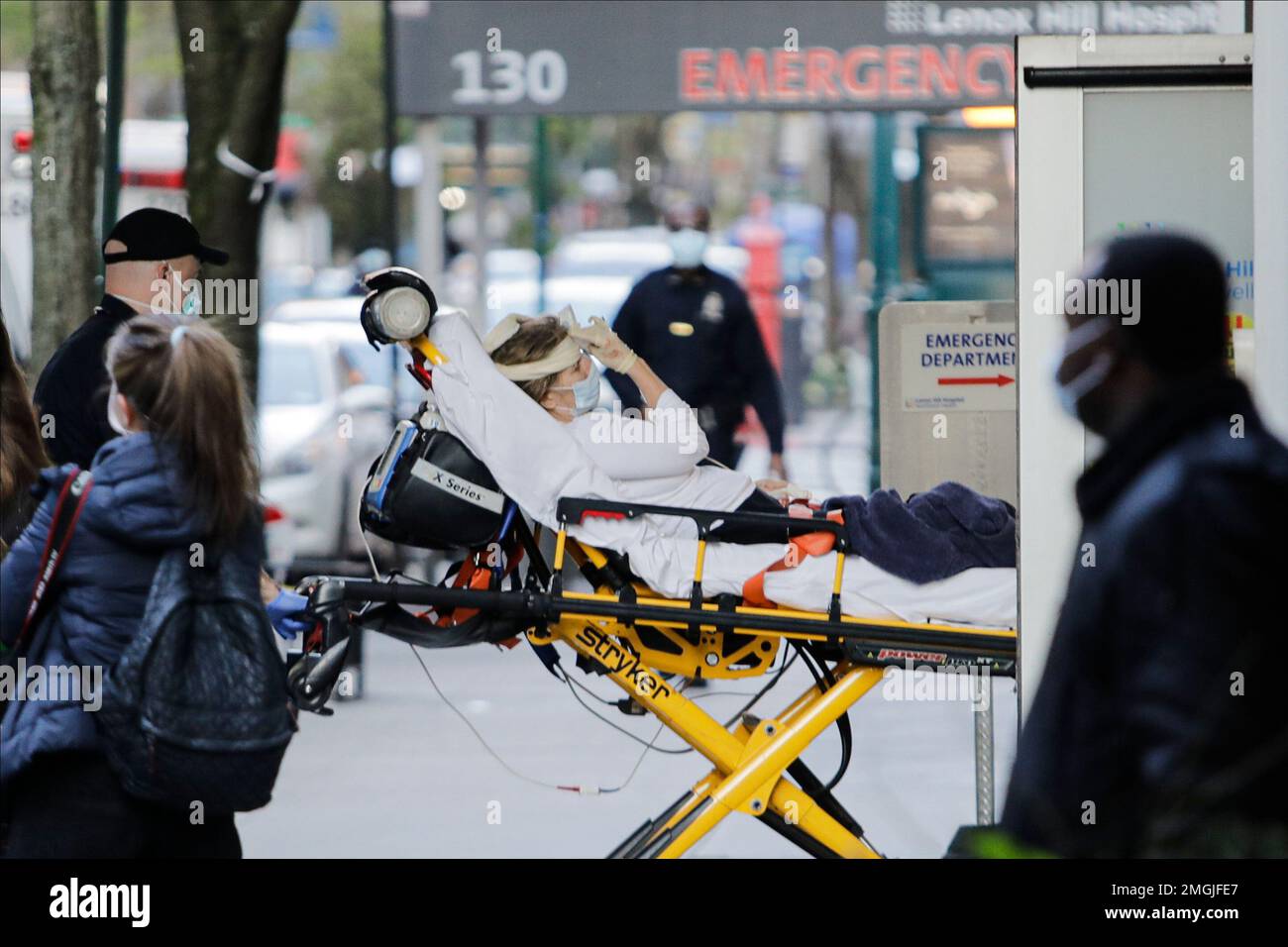 A patient arrives at Lenox Hill Hospital Wednesday, April 15, 2020, in ...