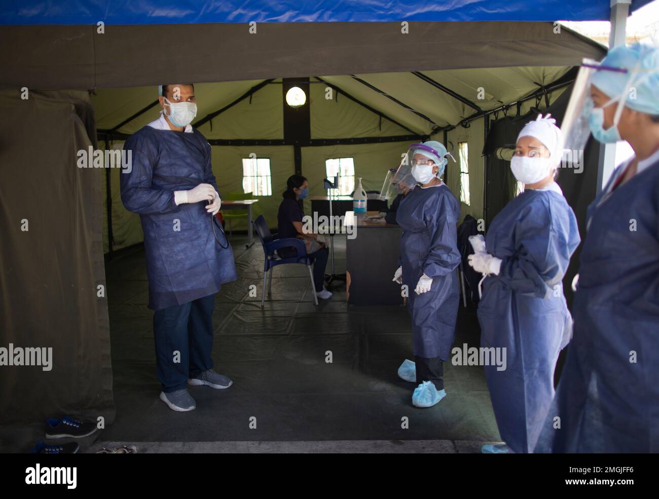 Venezuelan doctors stand at the entrance of a tent set up at the Ana ...