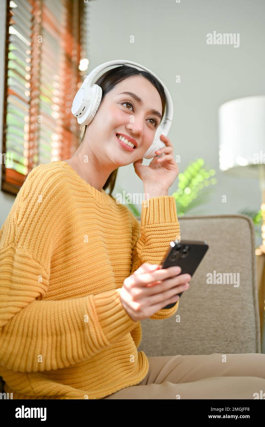 Portrait, Attractive millennial Asian woman in comfy clothes wearing ...