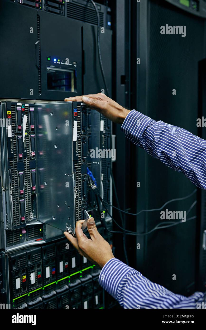 Expert hands taking care of hardware repair. an IT technician repairing ...