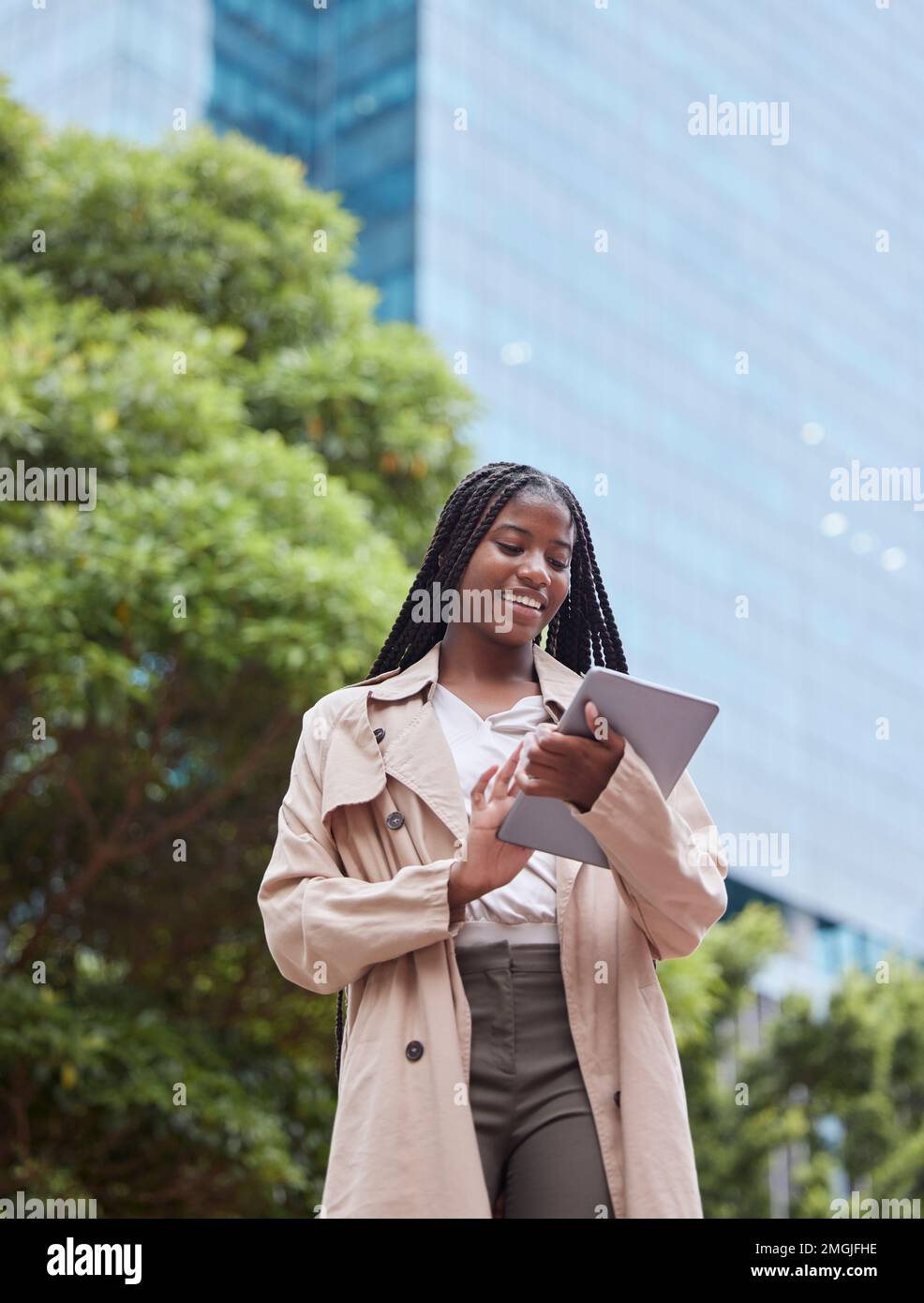 Tablet, business street and black woman in city, internet browsing or ...