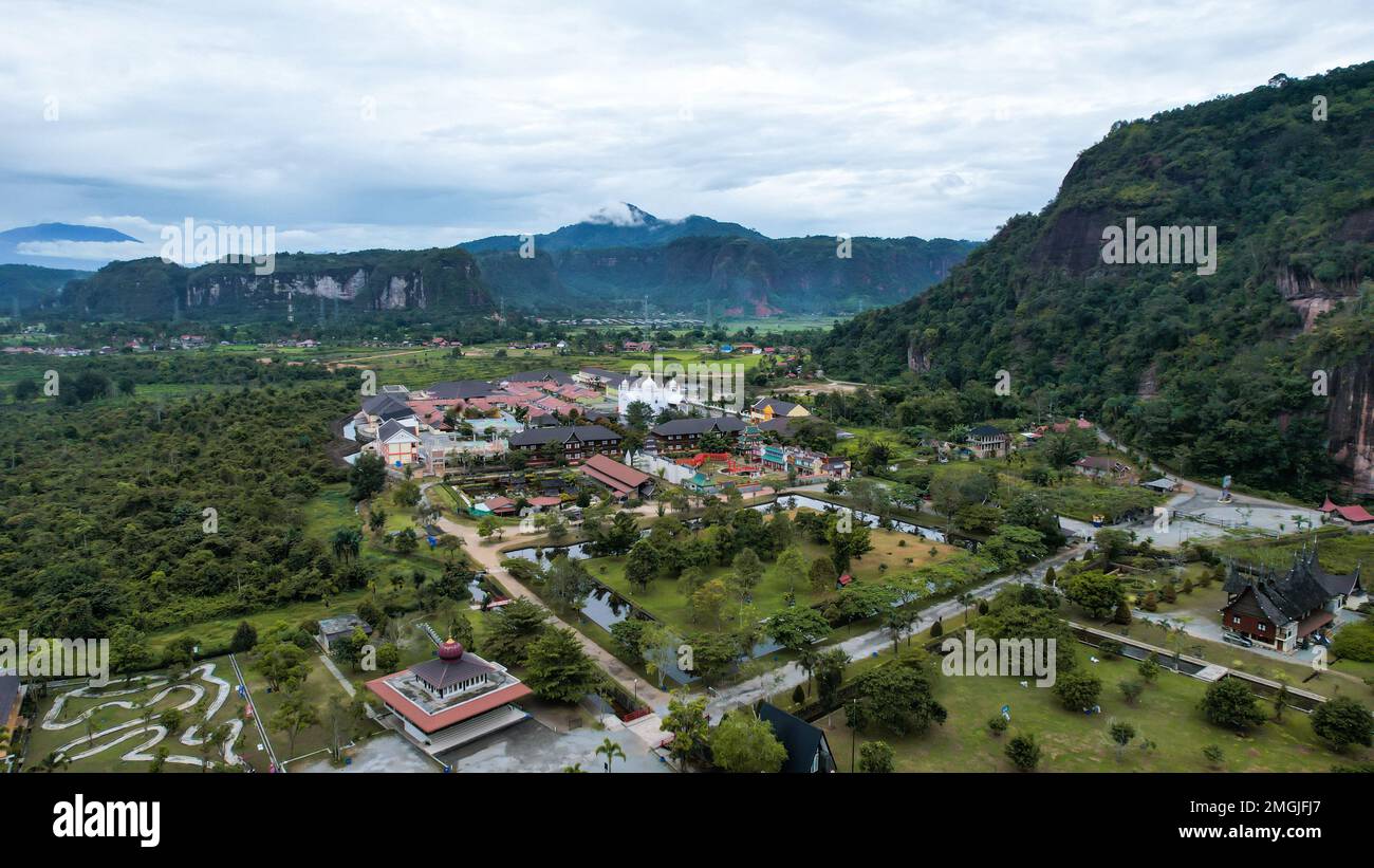Aerial view of white mosque in a beautiful landscape view of Harau ...