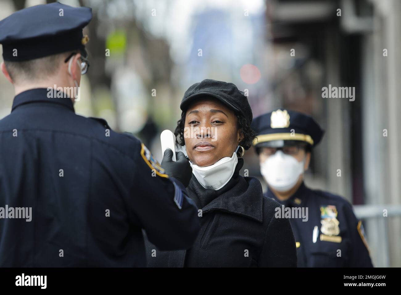 Officer Mahoney, left, screens people entering the 32nd precinct of the ...