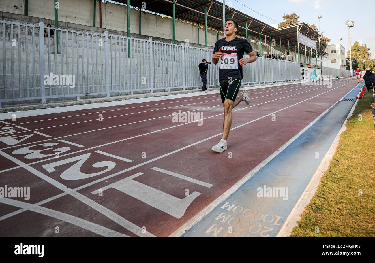 A Palestinian athlete competes in the 100-meter dash during the Middle ...