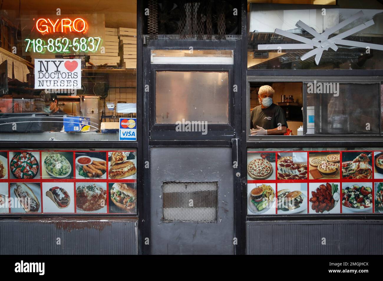 Workers wear personal protective equipment due to COVID-19 concerns in ...