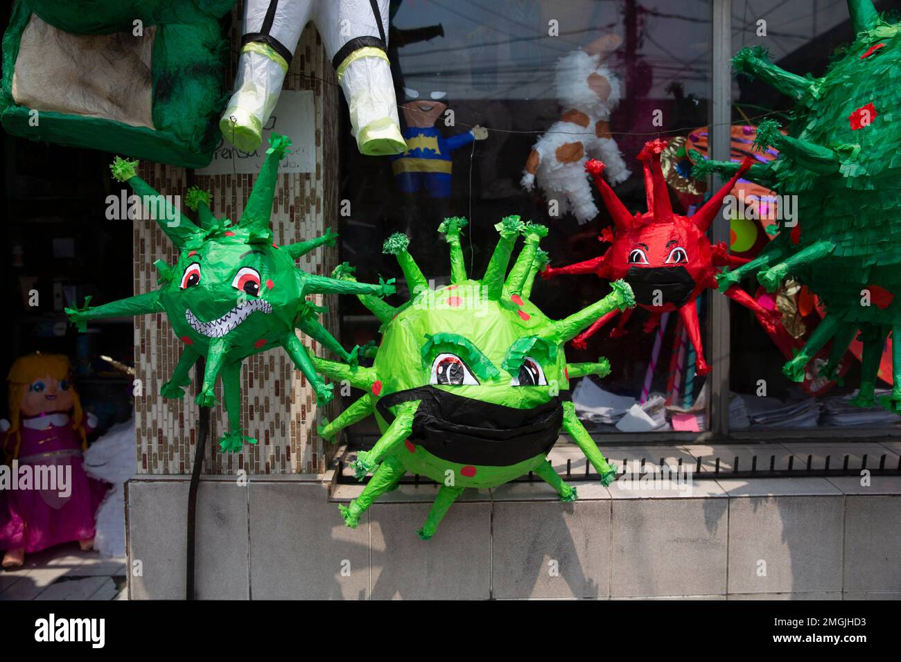 Piñatas depicting the new coronavirus are displayed in a store at Colon ...