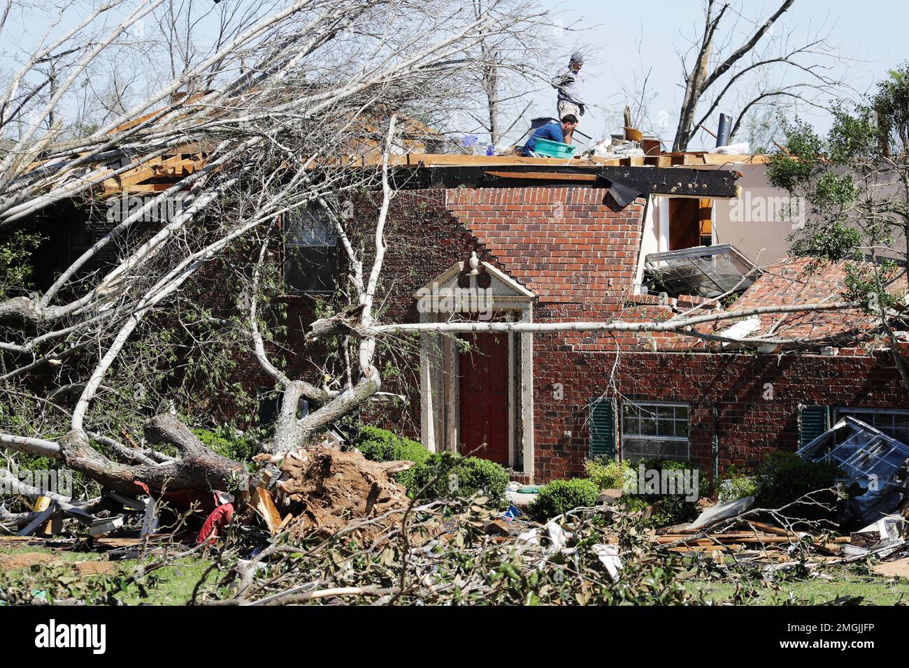 People work at a damaged home Tuesday, April 14, 2020, in Chattanooga ...