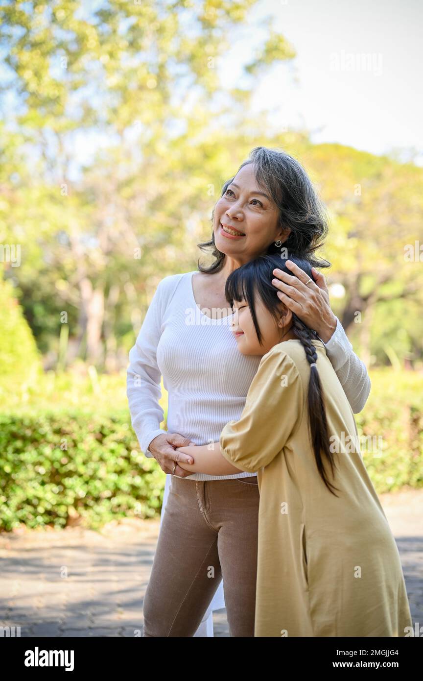 Portrait, Happy Asian grandmother and lovely little granddaughter ...