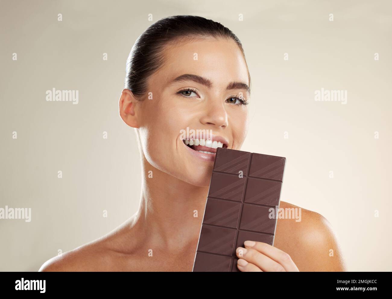 Beauty portrait, eating and woman with chocolate bar, junk food or ...