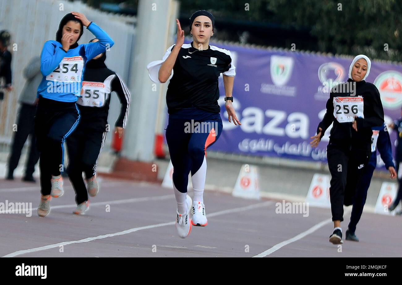 Palestinian women compete in the 100-meter race in the Palestine ...